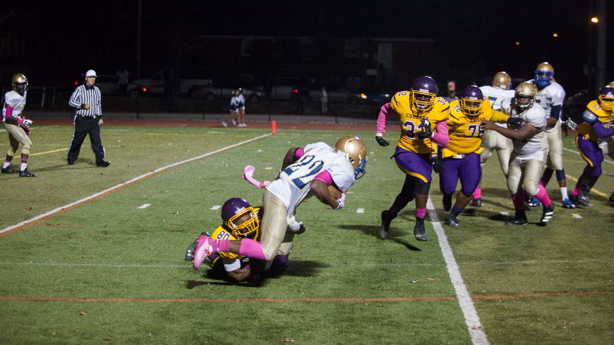 MLK Cougars secure playoff berth with 28-14 win over Washington - WHYY