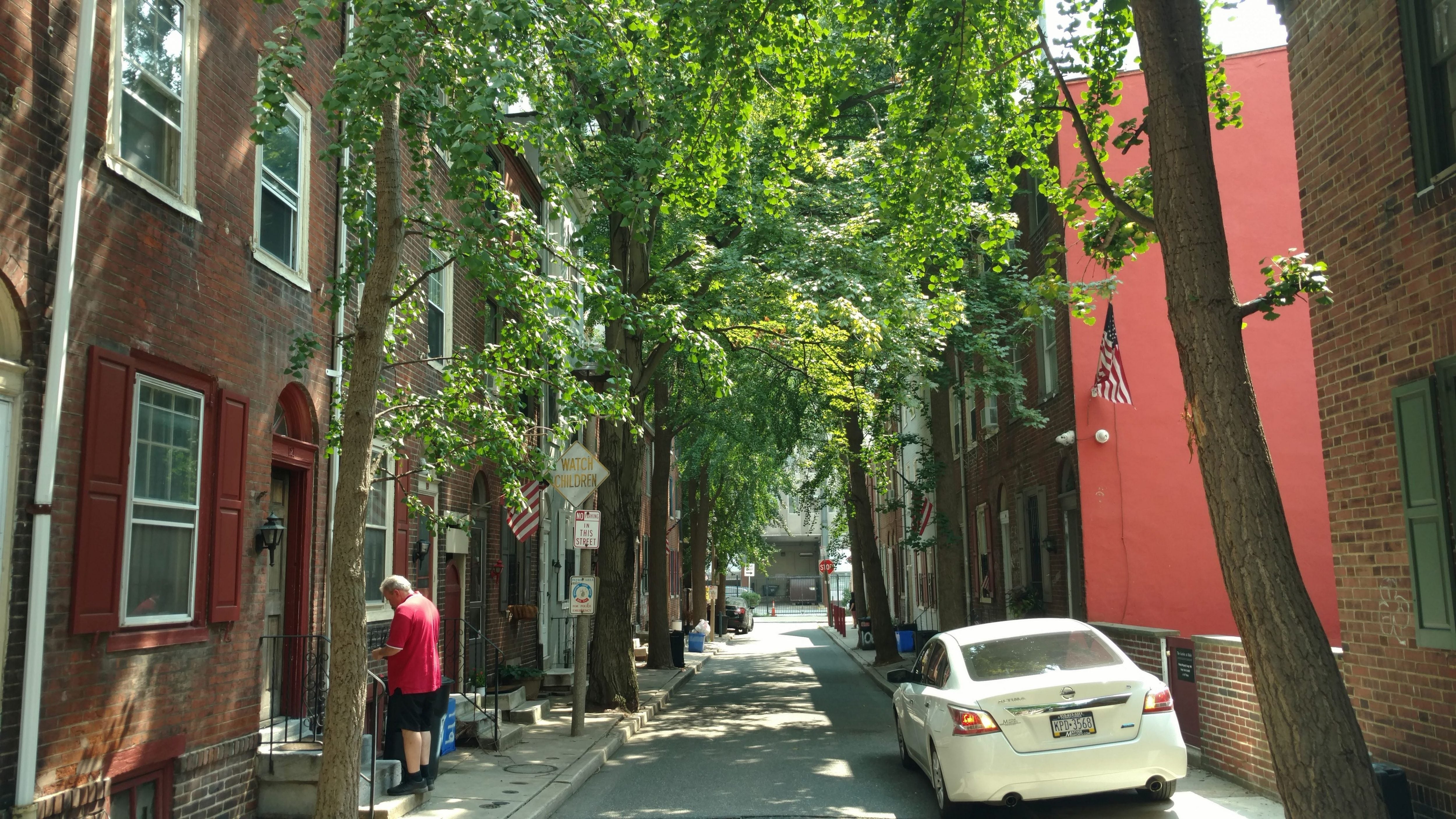 An intimate rowhouse block holds its own as towers rise around it - WHYY