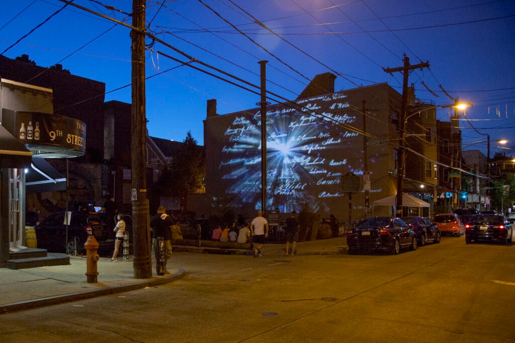 Philadelphia artists reimagine Rizzo mural wall in Italian Market - WHYY