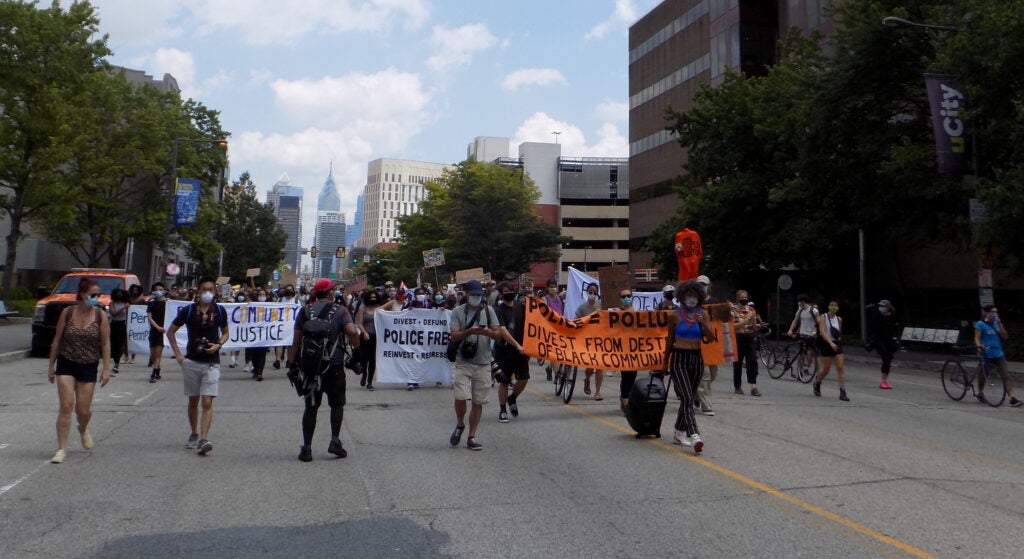 Marchers push Drexel, Penn to dissolve private police forces - WHYY